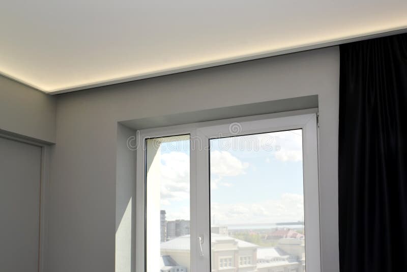 Window in the Living Room with the Hidden LED Illumination of a Stretch ...