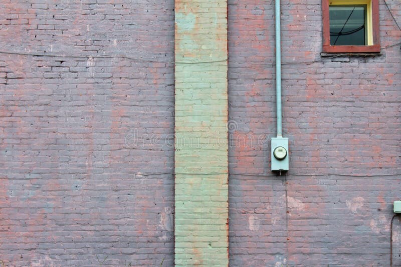 Window, Meter Box, and Column Against a Purple Painted Brick Wall Stock ...