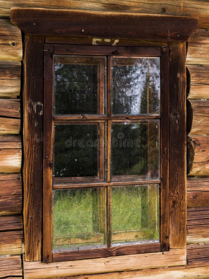 Window in an Old Rustic Log House with the Reflection of Meadow Stock ...