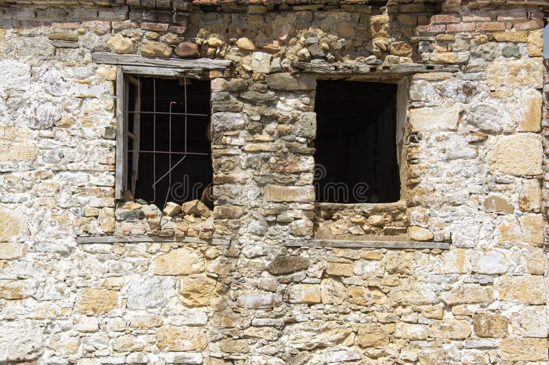 The Window of an Old Stone House with a Broken Window in the Foreground ...