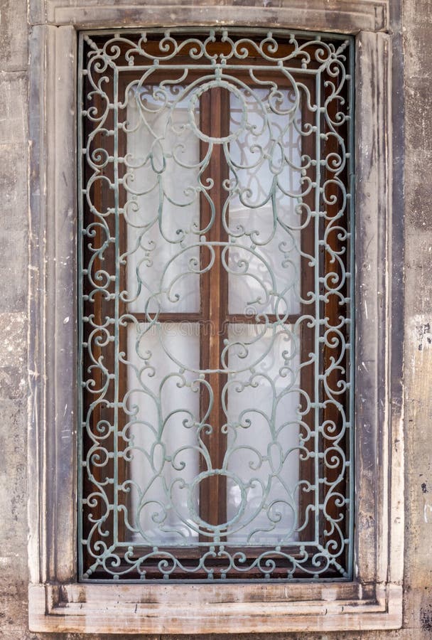 Window with Ornamented Metal Lattice on a Stone Building Stock Image ...