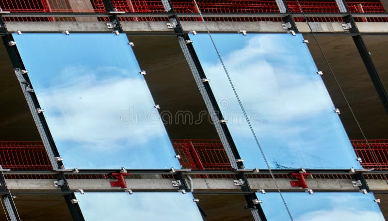 Window Panes in a Building Under Construction with Reflection of Blue ...