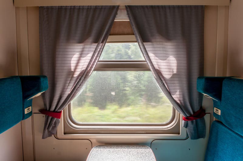 A Window and Part of the Interior of a Compartment Car Inside a ...