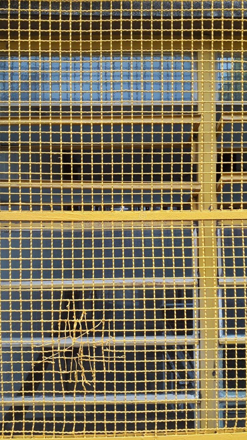 Window with Patched Yellow Grid Stock Photo - Image of building, urban ...