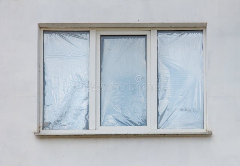A Window with Plastic Covering on it Stock Photo - Image of panes ...
