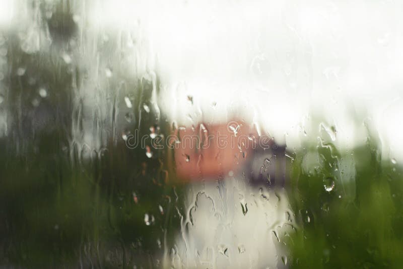 Window with Rain Drops with Wiev on a Forest and House Stock Image ...