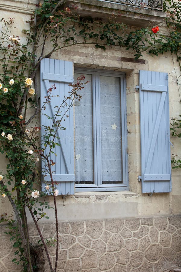 Window with red roses stock photo. Image of timber, loire - 32333606