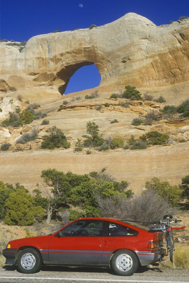 Window Rock Arch in Southern UT with Red Car in Foreground Editorial ...