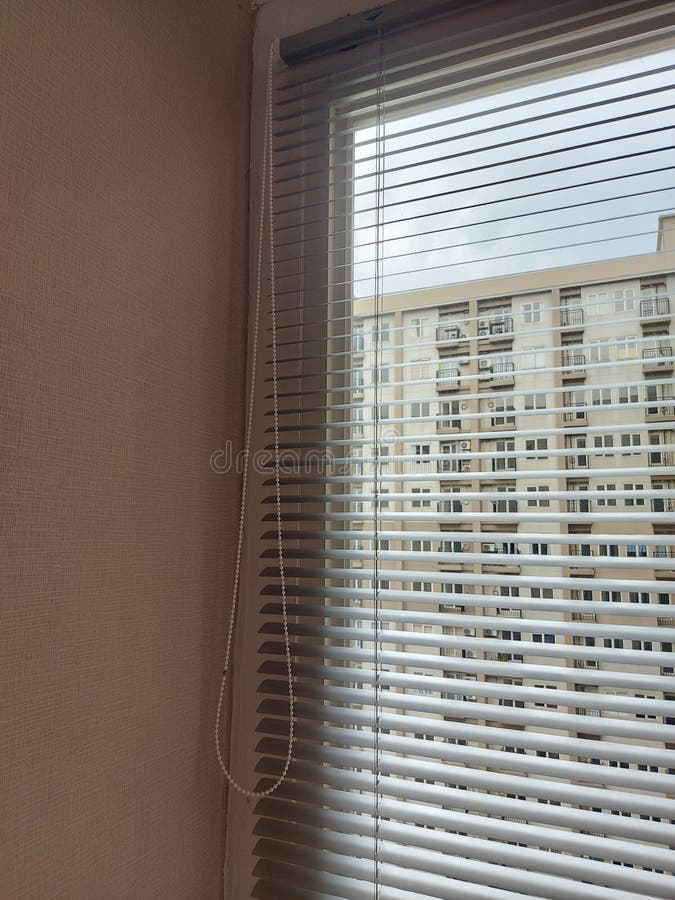 Window with Roller Shutters beside the Wall. with Apartment View ...