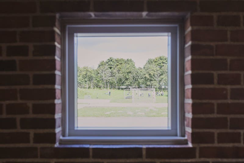 Window Showing Children Playing Soccer on Field Stock Image - Image of ...