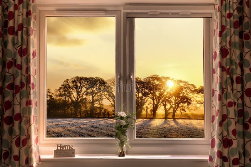 Window View Onto Glowing Sunset through Winter Trees Stock Image ...