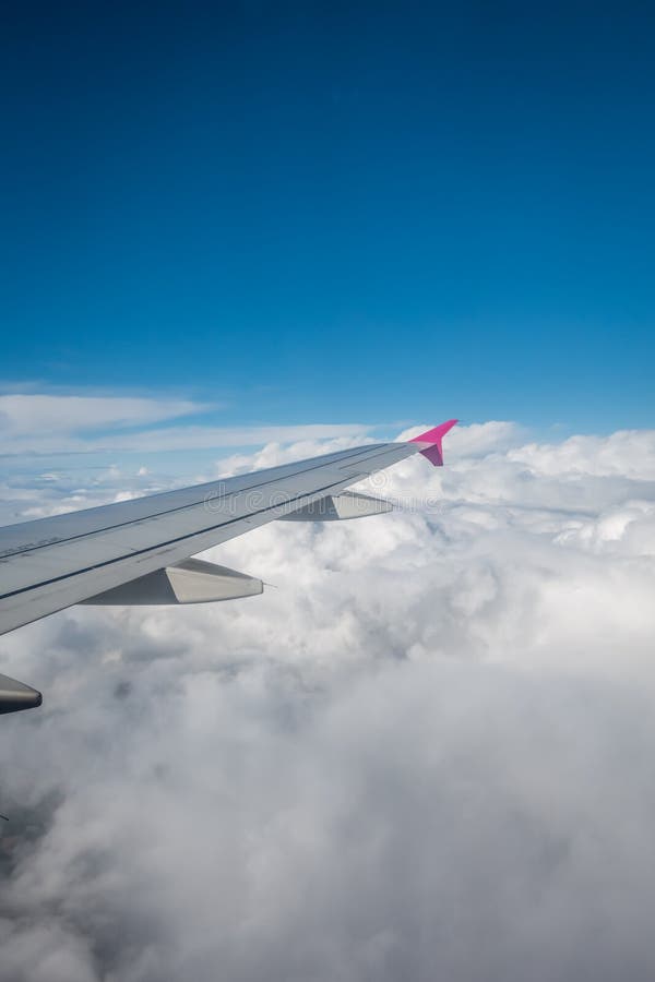 Airplane Wing Flying Above the Clouds Stock Image - Image of airline ...