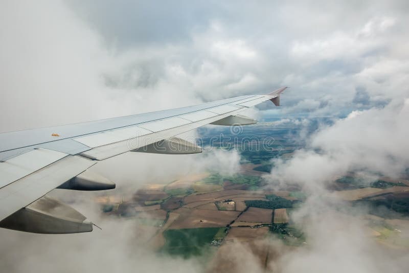 Airplane Wing Flying Above the Fields Stock Photo - Image of dense ...