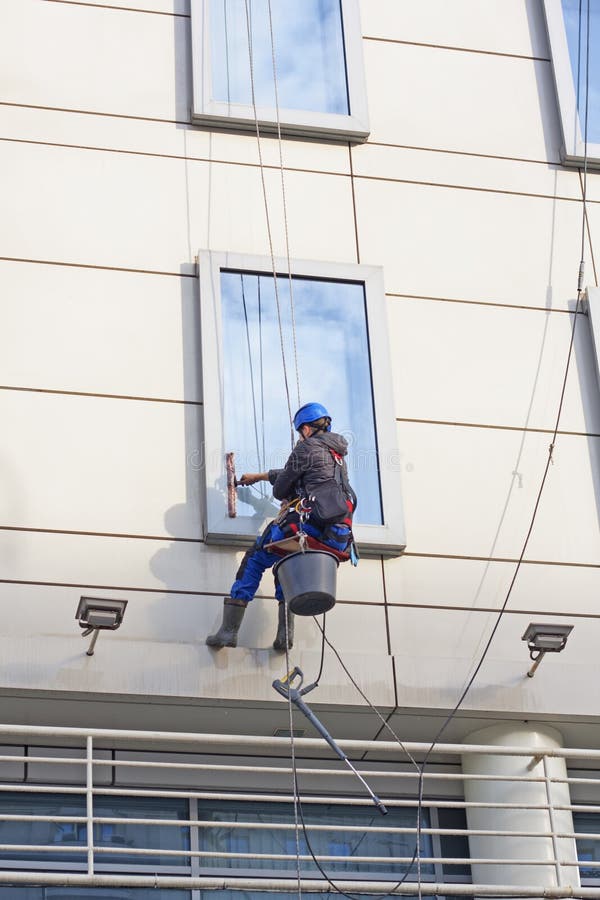 Window Washer on a High Building Editorial Stock Photo - Image of cable ...