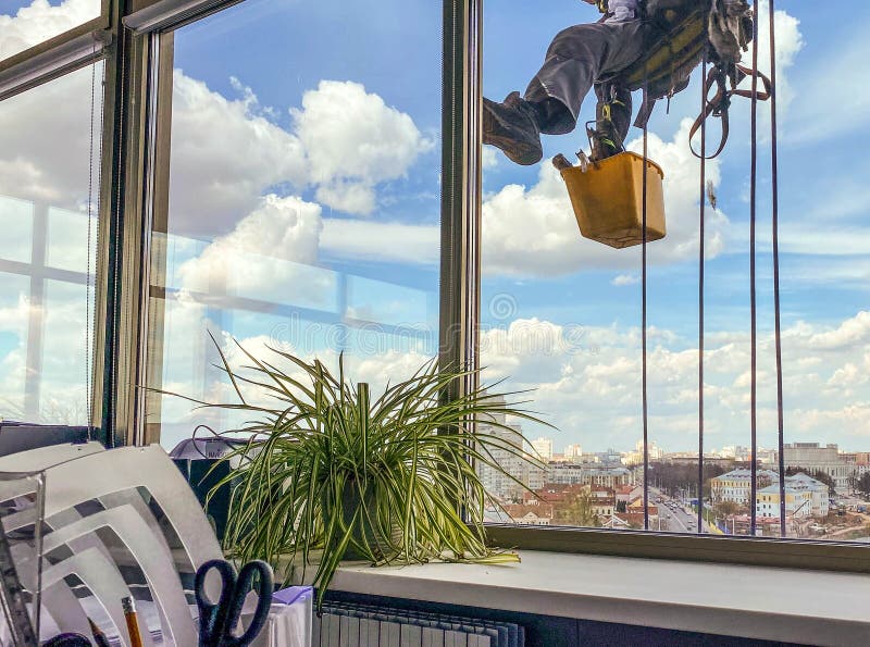 Window Washer on Side of Office Building Stock Photo - Image of person ...