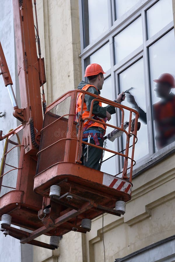 Window Washer Works on Truck Mounted Lift Stock Photo - Image of glass ...