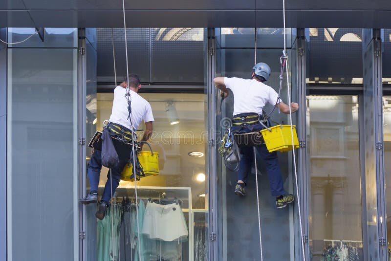 Window Washers Cleaning Windows of Shopping Center Stock Photo - Image ...
