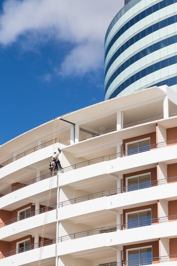 Window Washers on Modern Hotel Stock Photo - Image of wall, workers ...