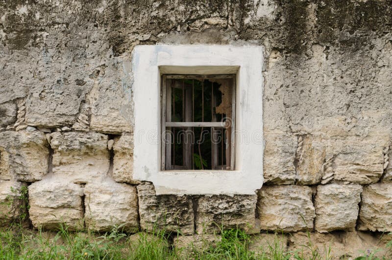 Window with White Frame on a Wall of Dusty and Rusty Stones. Stock ...