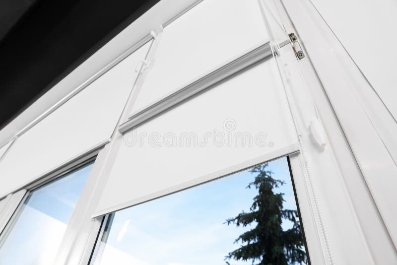 Window with White Roller Blinds Indoors, Low Angle View Stock Photo ...