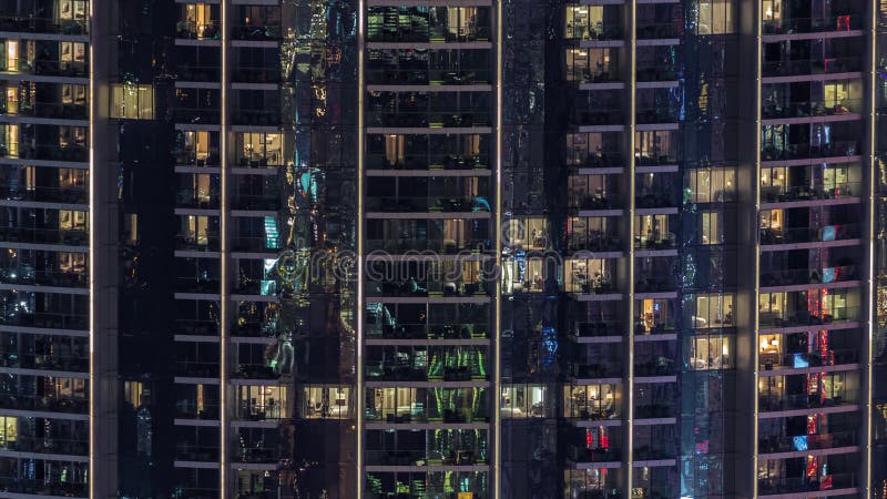 Windows in Apartments of a High Class Building at Night Timelapse Stock ...