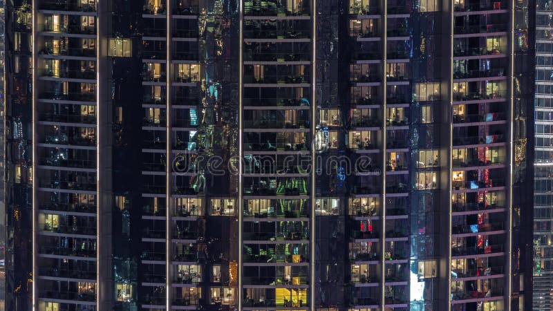 Windows in Apartments of a High Class Building at Night Timelapse Stock ...