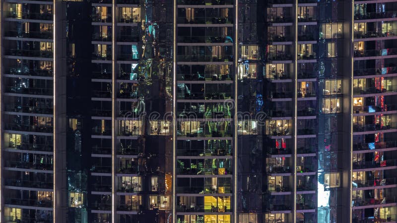 Windows in Apartments of a High Class Building at Night Timelapse Stock ...