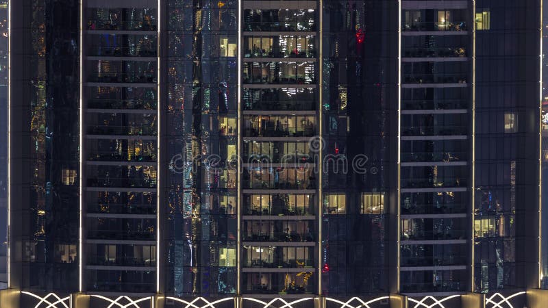 Windows in Apartments of a High Class Building at Night Timelapse Stock ...