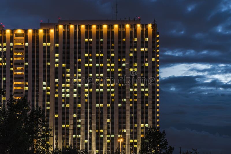 The Windows of the Big Hotel are Shining Warmly Against the Background ...