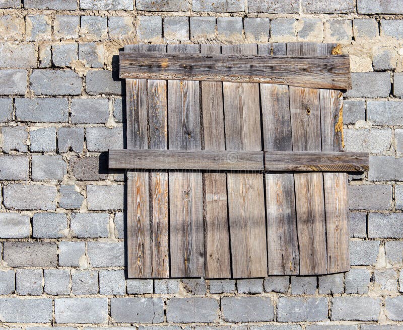 The Windows of a Brick House Boarded Up with Wooden Boards Stock Image ...