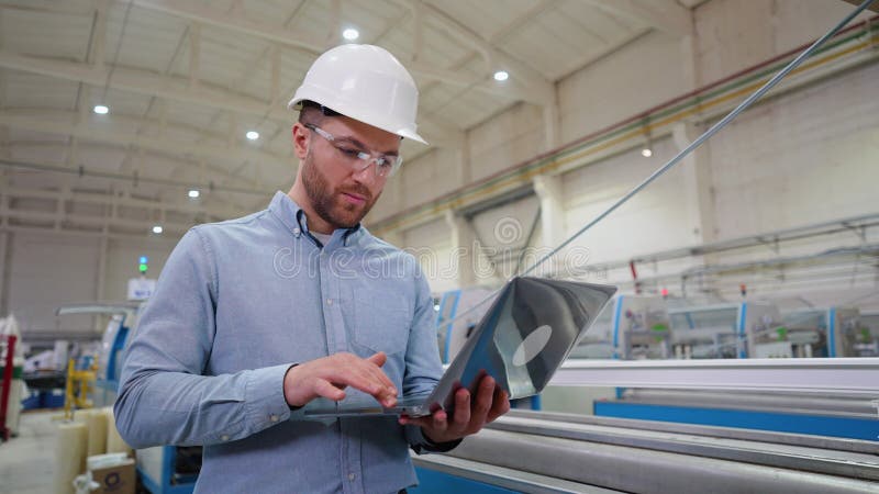 Windows Factory Chief Engineer with Laptop Gives a Task To Indian ...