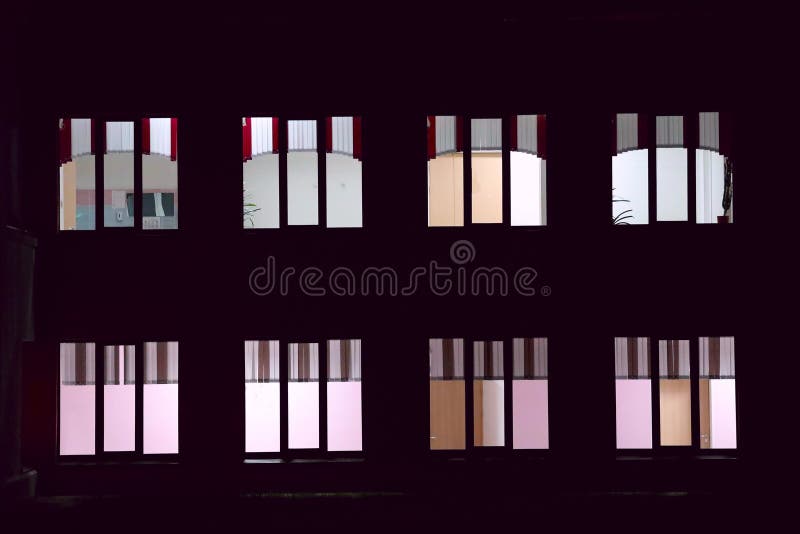 Windows Glow in an Apartment Building at Night Stock Photo - Image of ...