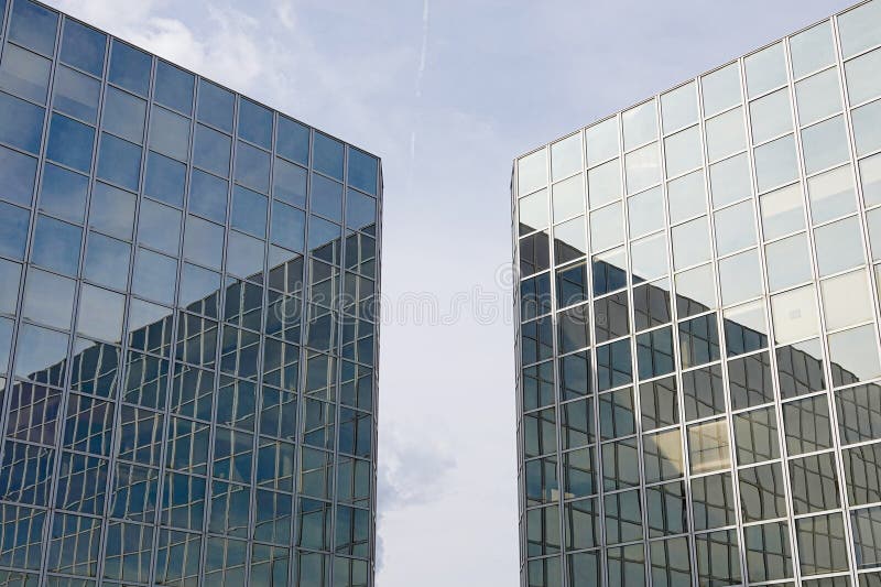 Windows of a Large Office Building with a Reflection of the Sky Stock ...