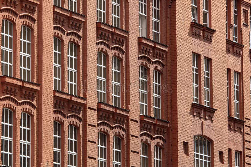 Windows in a Multi-storey Brick Building As a Background Stock Photo ...