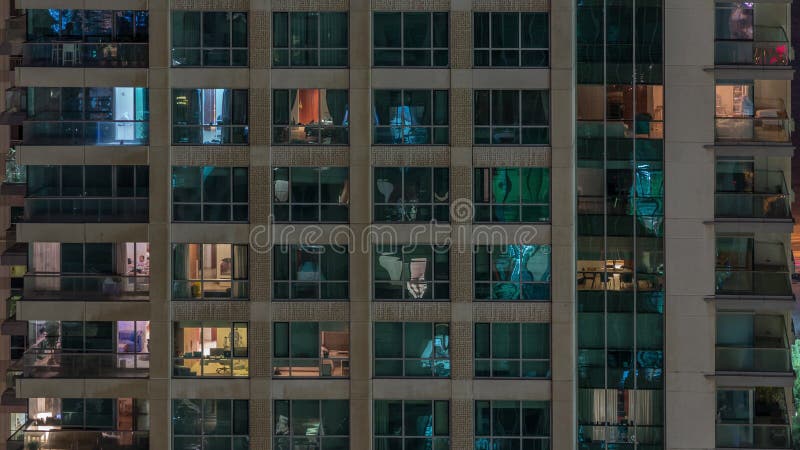 Windows of the Multi-storey Building with Lighting Inside and Moving ...