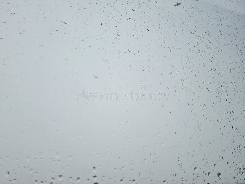 Windows with Raindrops Against Gray Sky Closeup Stock Photo - Image of ...