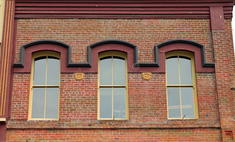 Windows in a Red Brick Wall Stock Image - Image of decorative, three ...