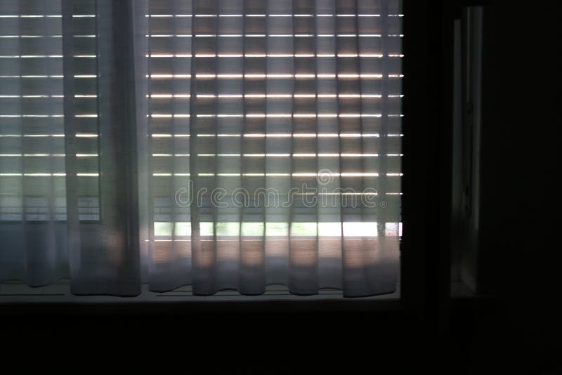 Windows Roller Shutter Down. Dark Room with Dim Light Stock Image ...