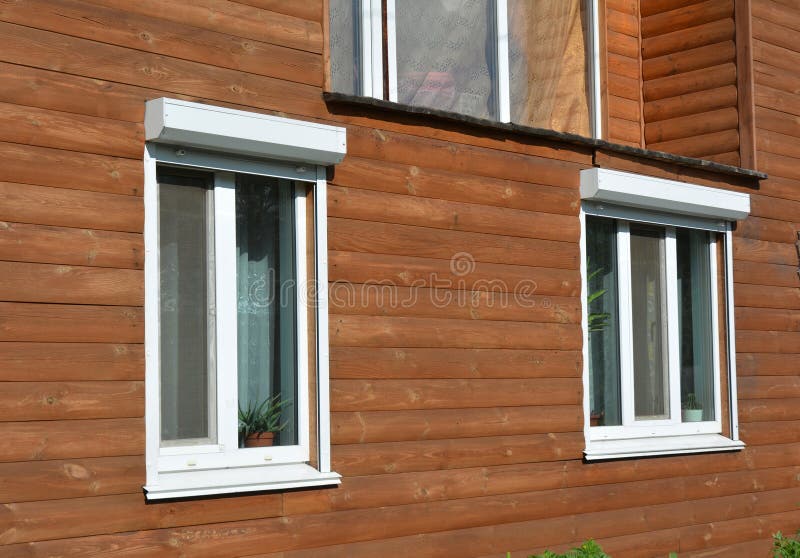 Windows with Rolling Shutter on the Wooden House Facade Exterior Stock ...