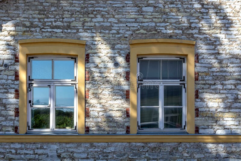 Windows on a stone wall stock image. Image of glass - 154191921