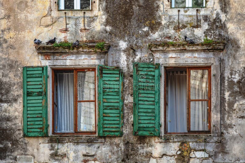 Windows in Wall of Ancient Stone House in Old Town Stock Image - Image ...