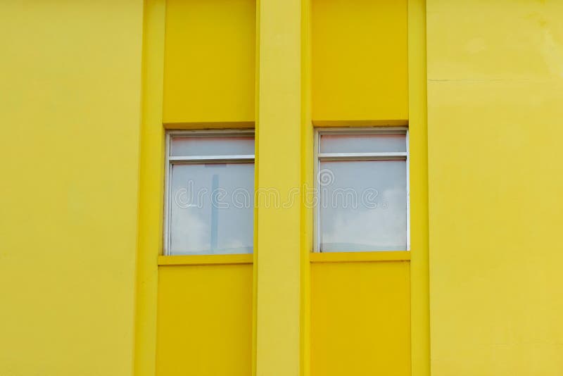 Windows on a Yellow Building Stock Image - Image of texture, color ...
