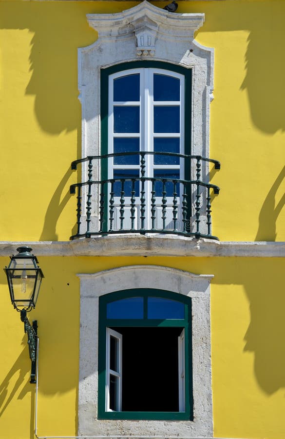 Windows and Yellow Colored Facade Building in Lisbon, Portugal Stock ...