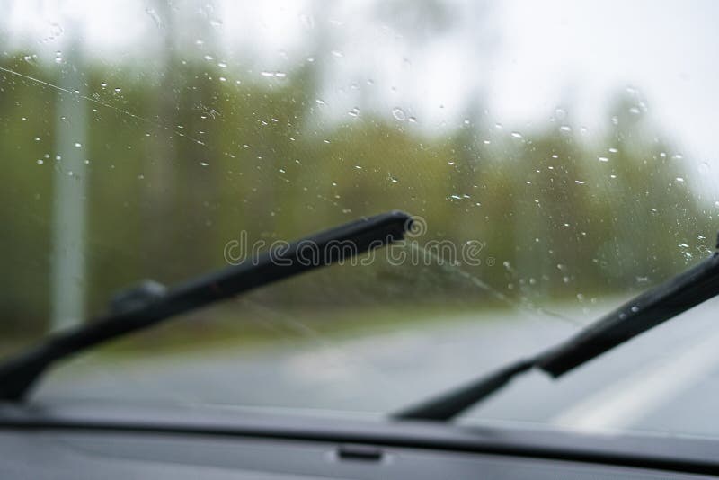 Windscreen Wipers Wipe Raindrops from the Windshield Against the ...