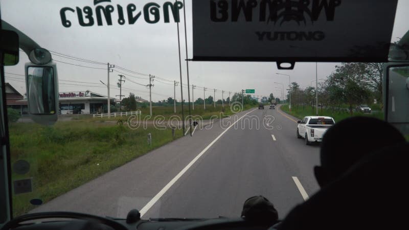 Windshield and Dashboard View from Inside of Bus, Driving on Highway in ...