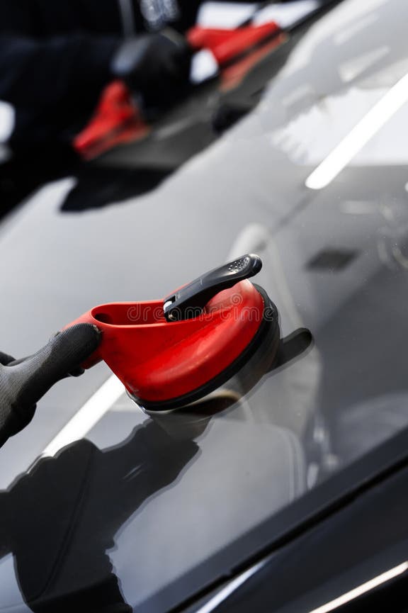 Windshield Installation Using Suction Lifters. Two Technicians Install ...