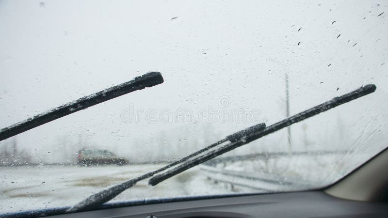 The Windshield Wipers on a Car are Covered in Snow and Ice Stock Photo ...
