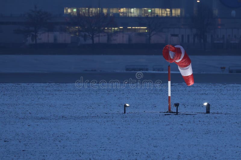 Windsock in Airport Area, Snow in Winter Stock Photo - Image of night ...