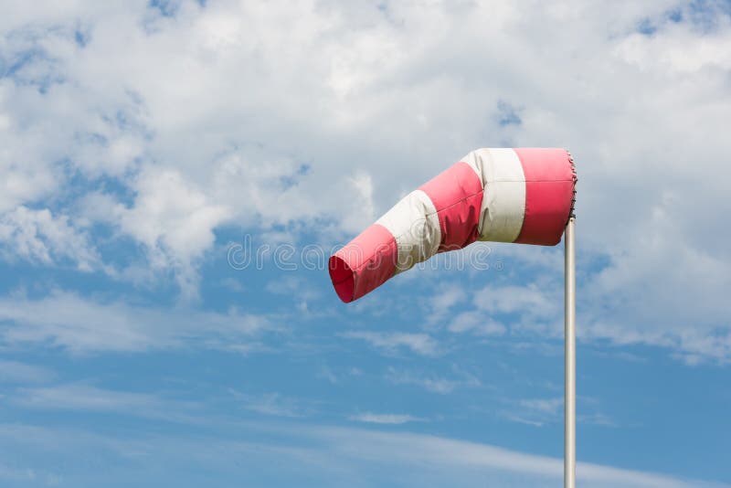 Windsock Blowing in Wind Against Cloudy Sky Stock Photo - Image of flow ...