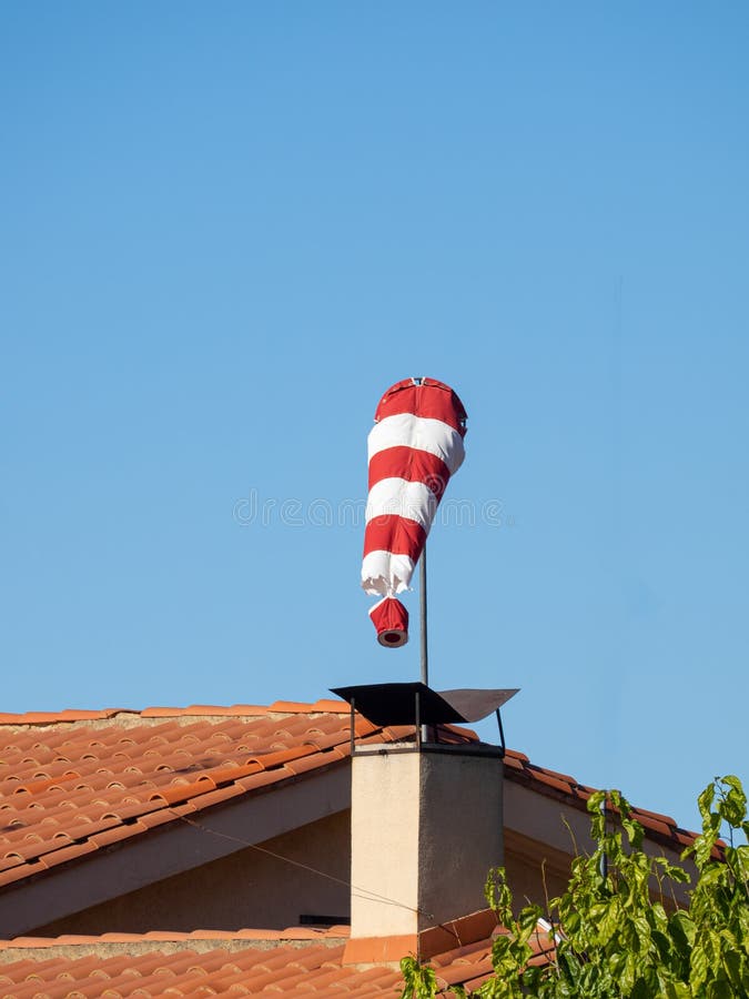 Windsock Floating Horizontally Above a House Stock Image - Image of ...